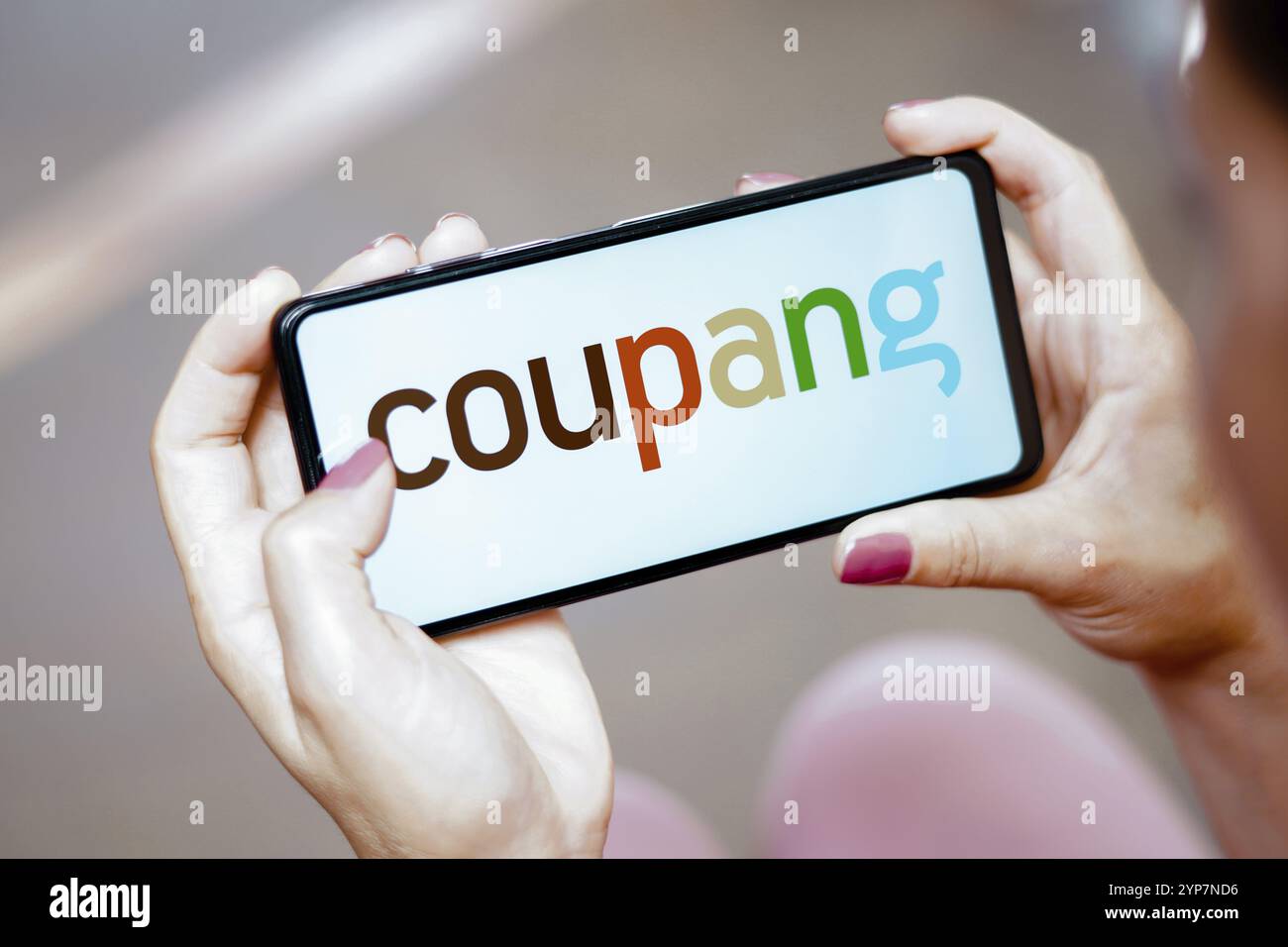 In this photo illustration, the Coupang logo app is seen displayed on a smartphone Stock Photo ...