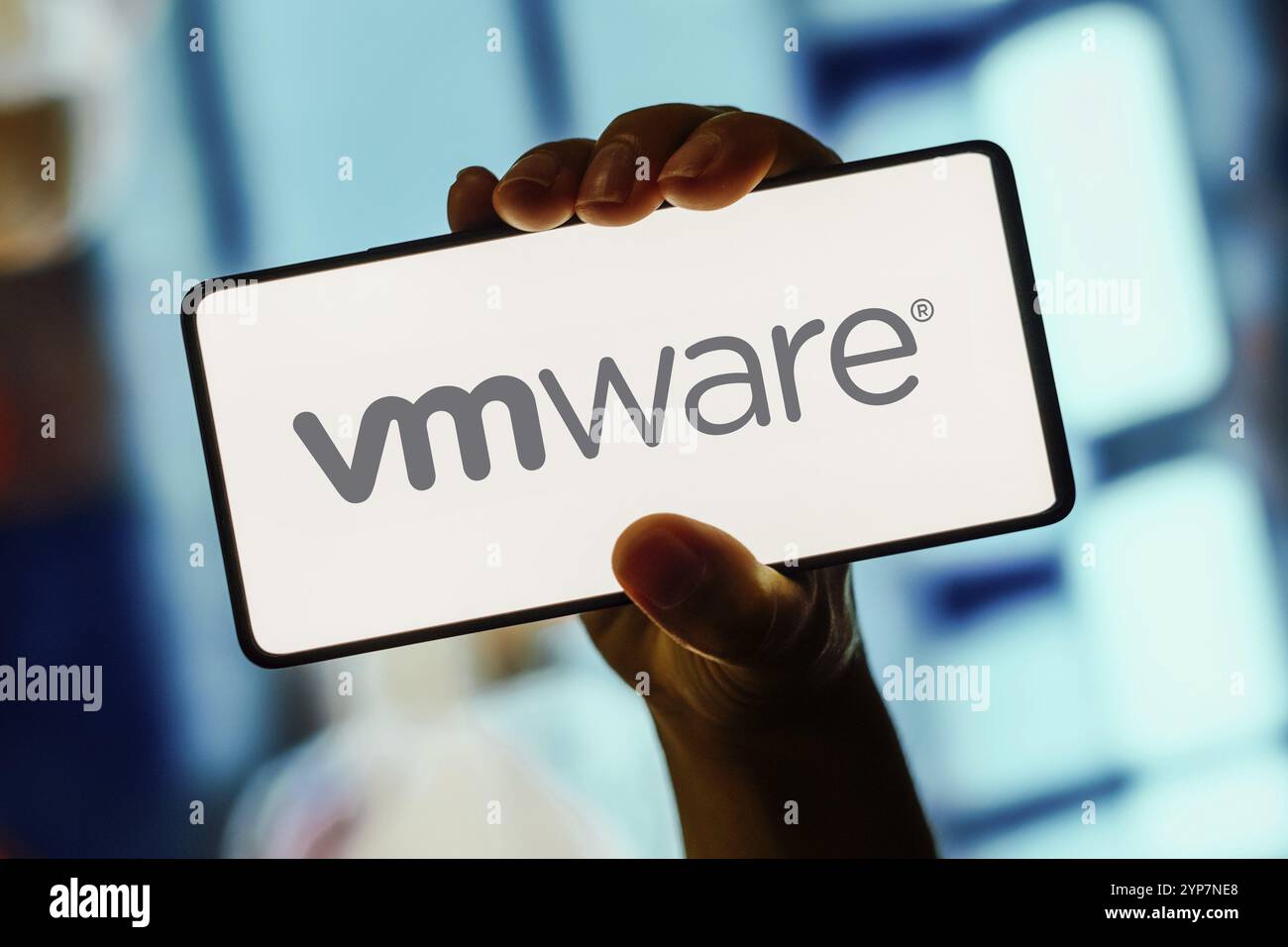 In this photo illustration, the VMware logo is displayed on a ...