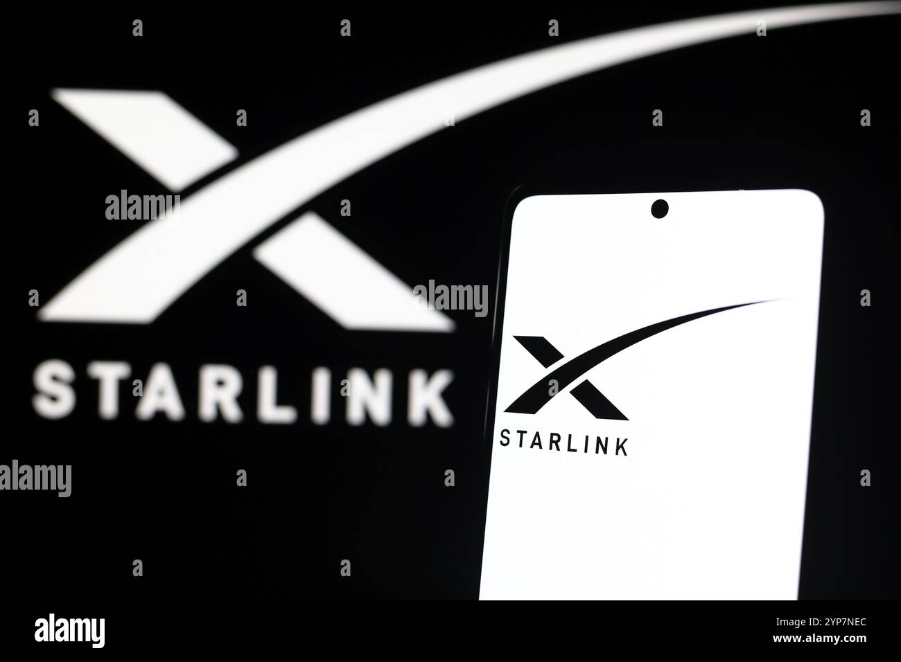 In this photo illustration, the Starlink logo is displayed on a ...