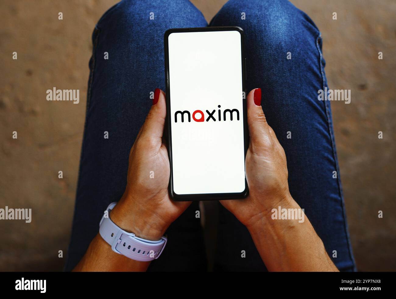 In this photo illustration, the Maxim logo is displayed on a smartphone ...