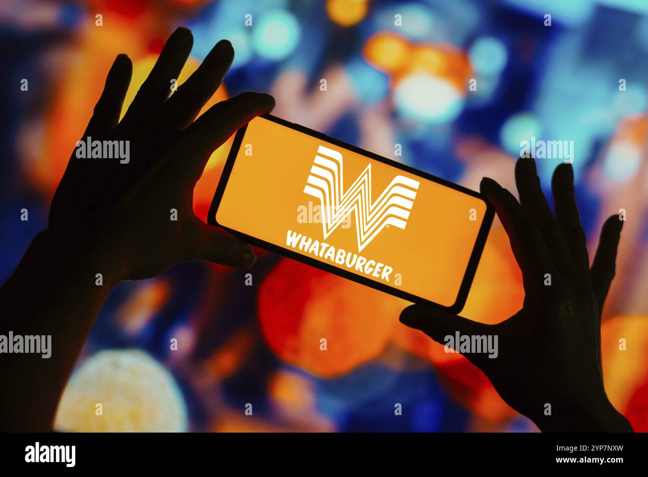 In this photo illustration, the Whataburger logo seen displayed on a ...