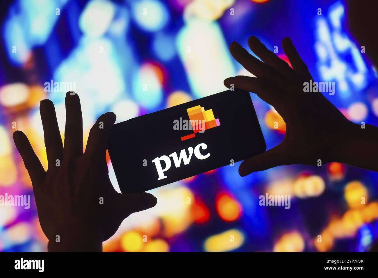 In this photo illustration, the PwC logo is displayed on a smartphone ...