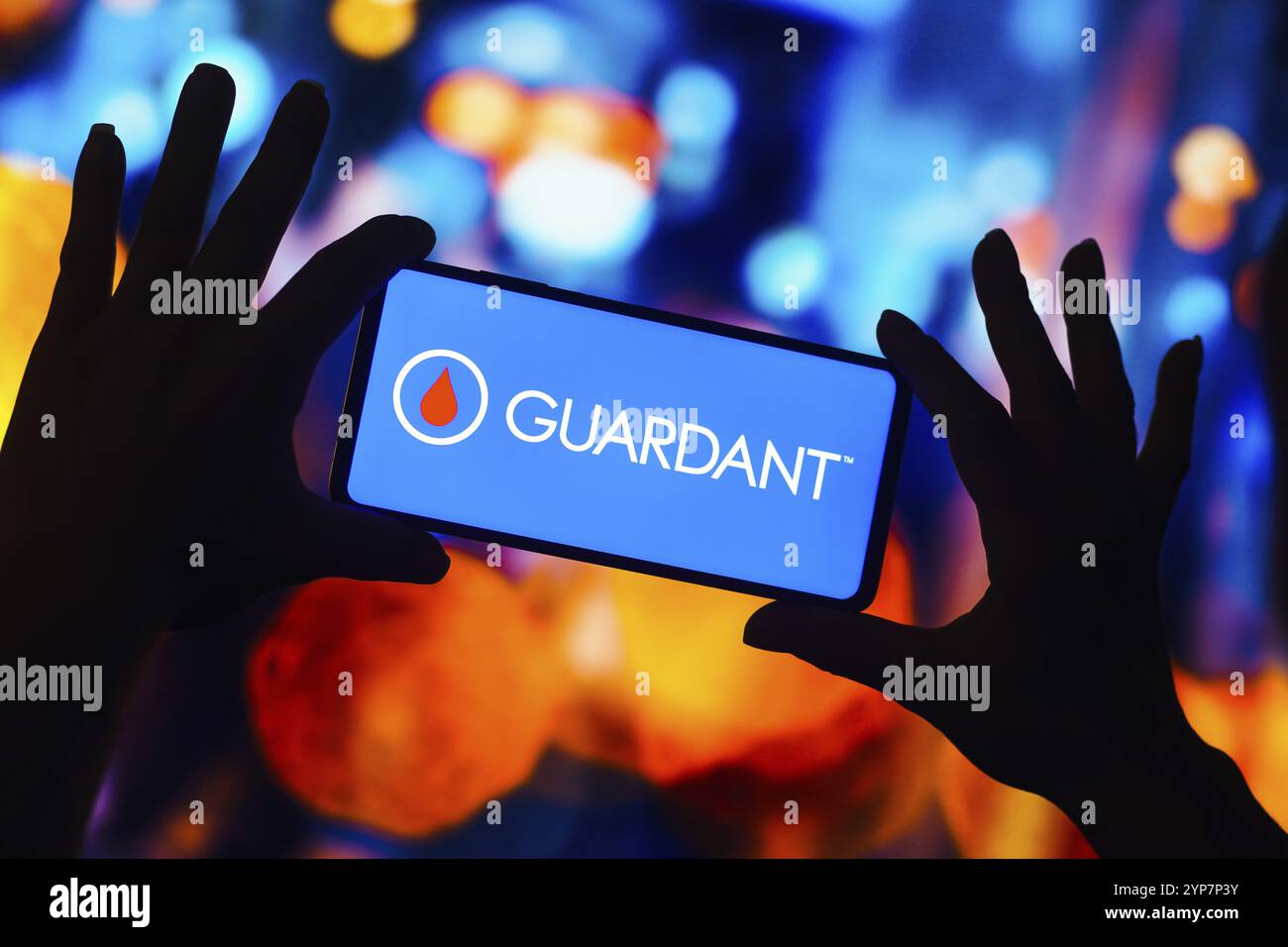 In this photo illustration, the Guardant Health logo is displayed on a ...