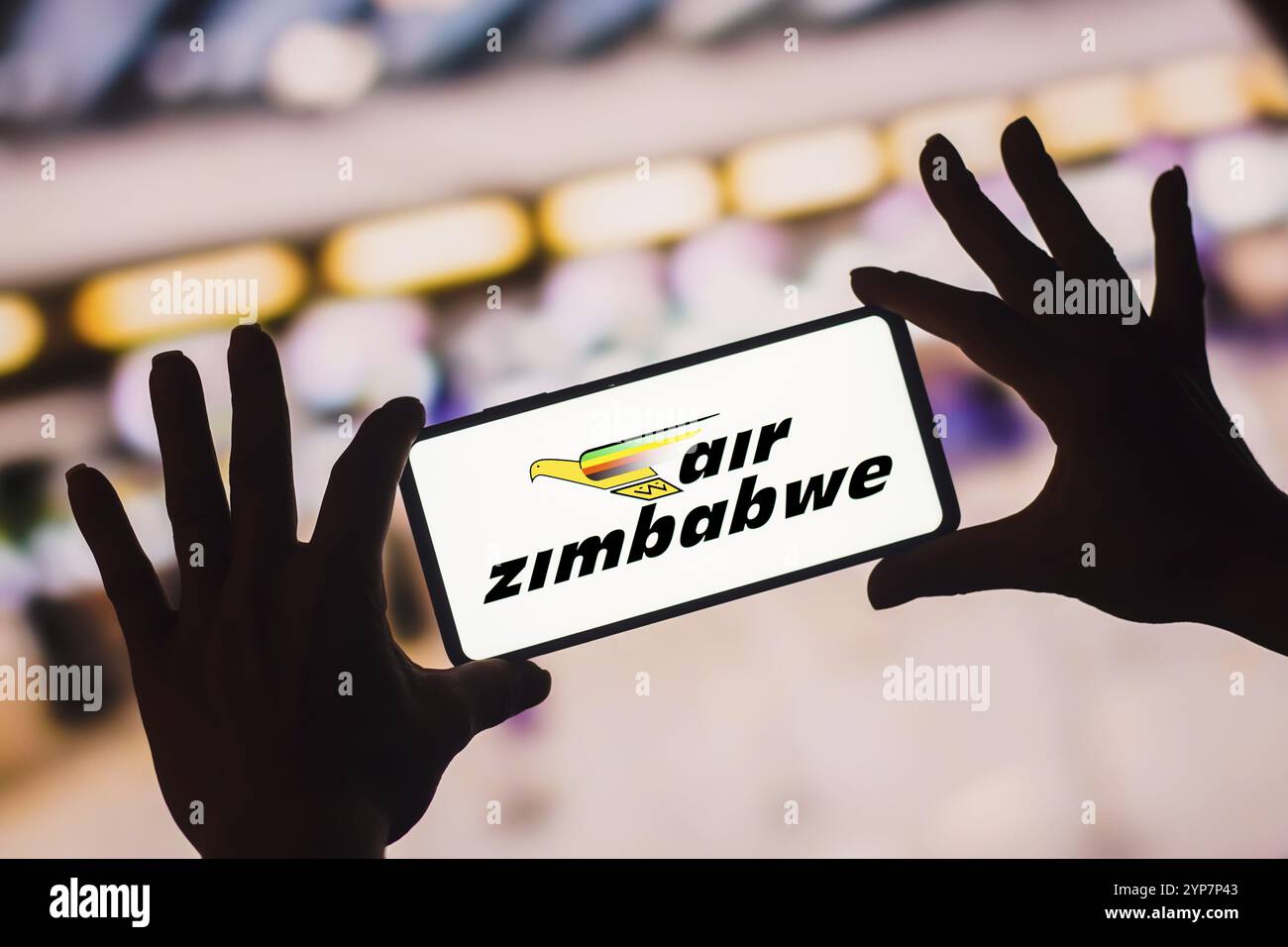 In this photo illustration, the Air Zimbabwe logo is displayed on a ...