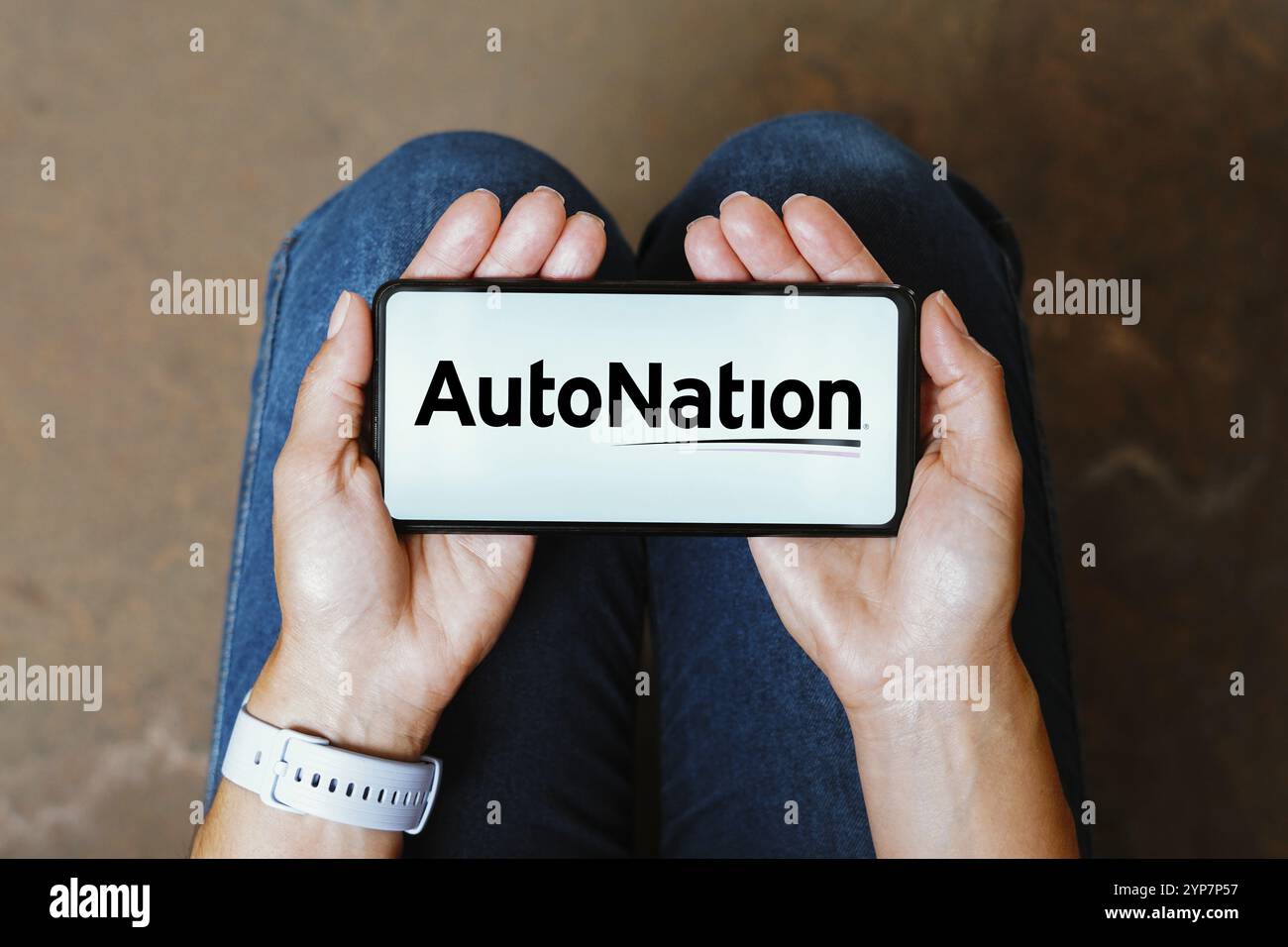 In this photo illustration, the AutoNation logo is displayed on a ...