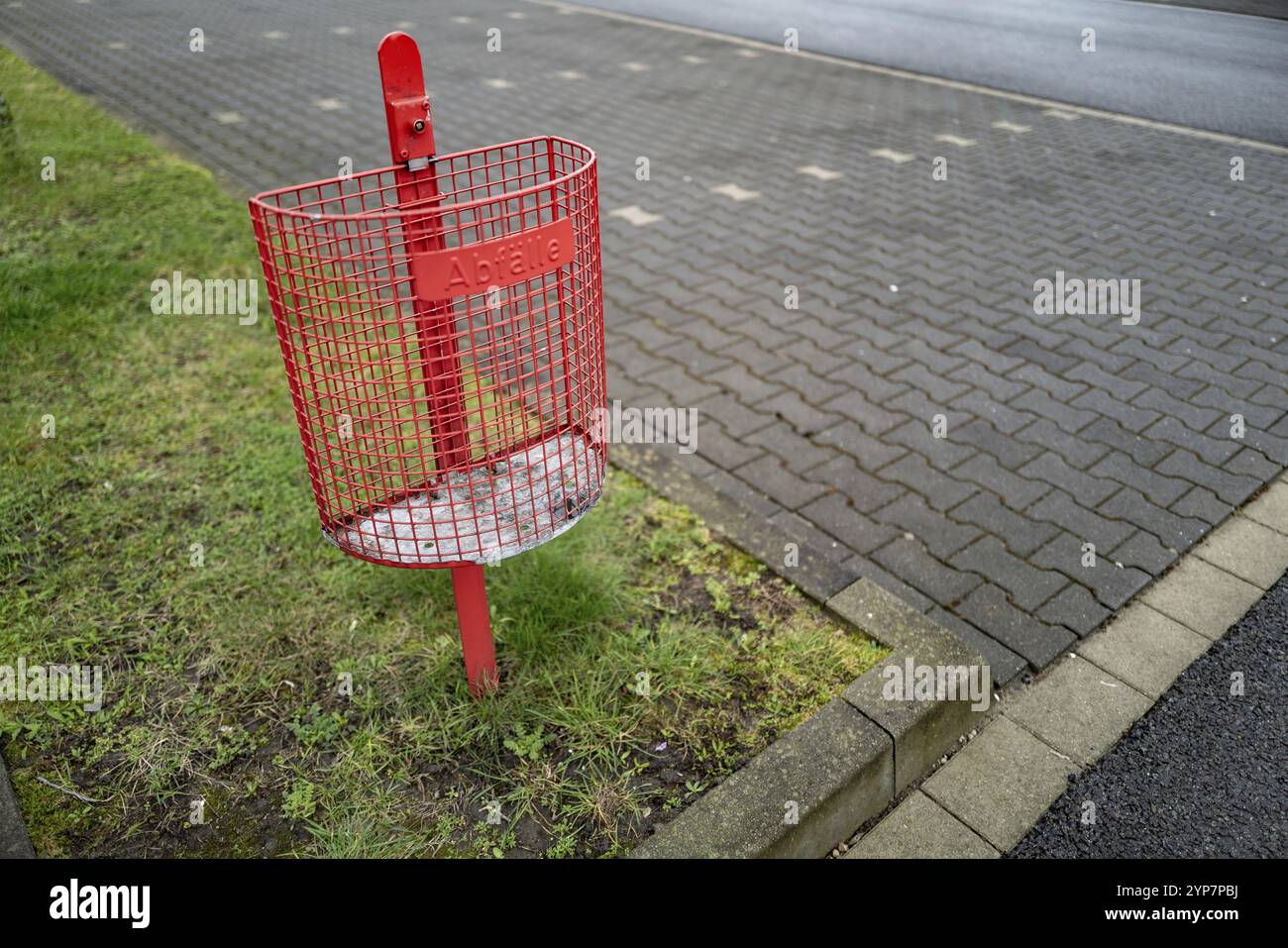 Red litter bin on the roadside Stock Photo - Alamy