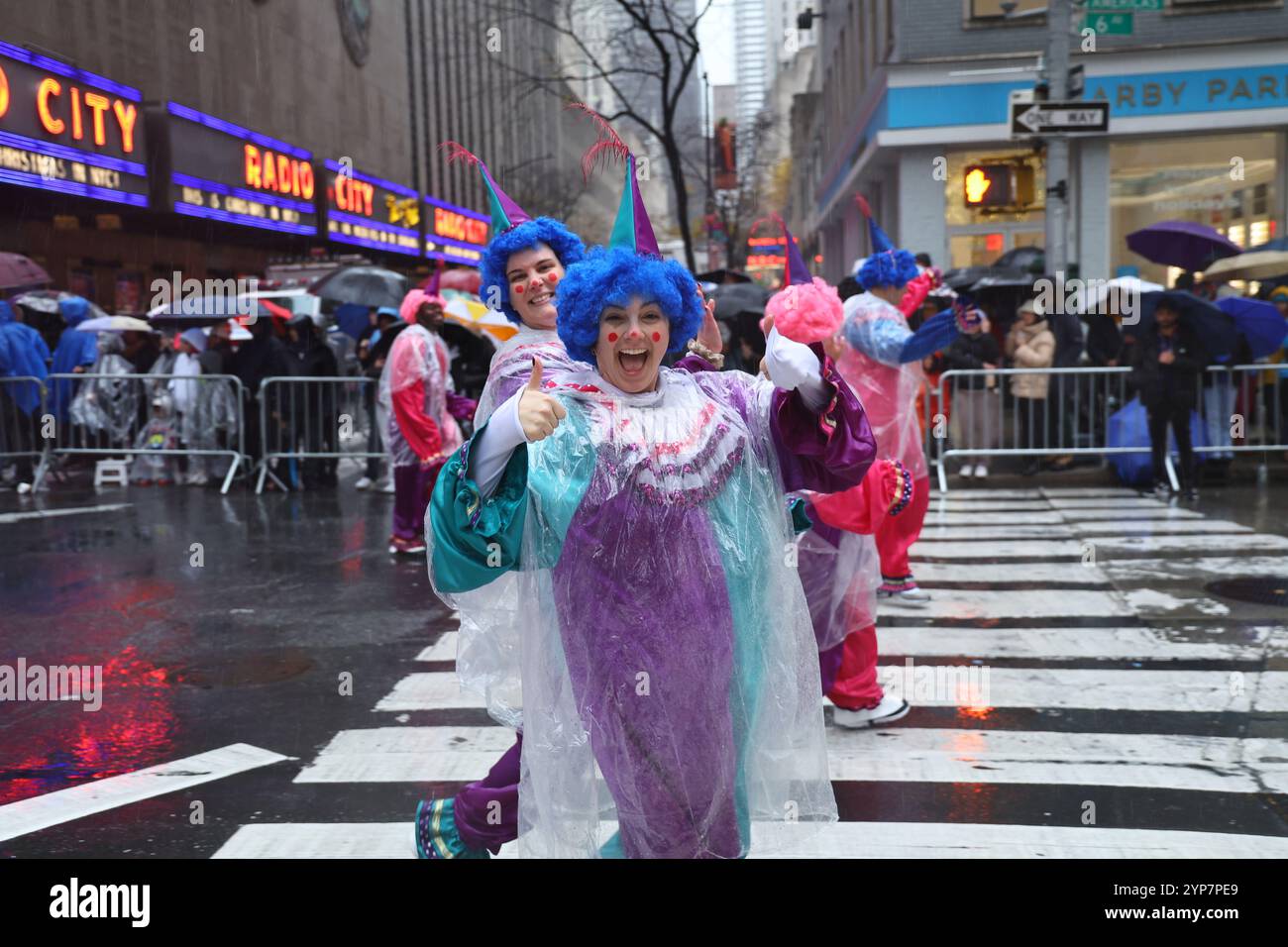 The Holiday Clowns entertain the crowds on Central Park West during The ...