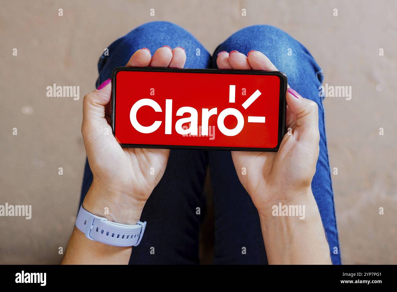 In this photo illustration, the Claro logo is displayed on a smartphone ...