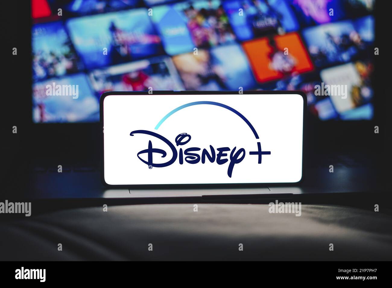 In this photo illustration, the Disney Plus logo is displayed on a ...