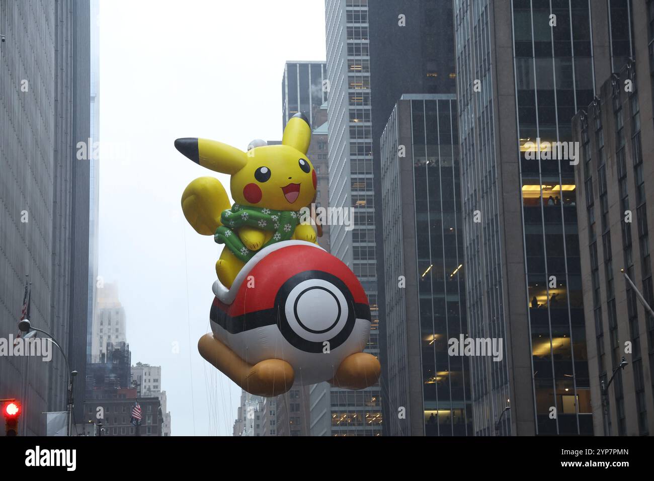 The Pikachu & Eevee balloon heads down Sixth Avenue during The 98th ...
