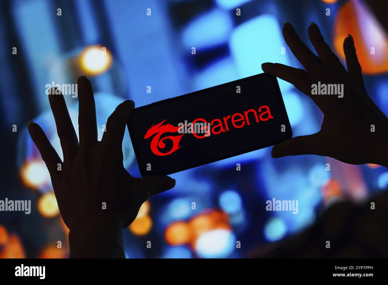 In this photo illustration, the Garena logo is displayed on a ...