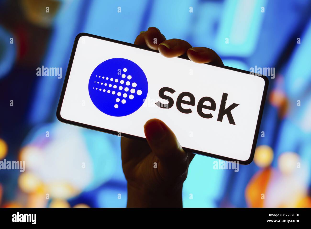 In this photo illustration, the SEEK logo is displayed on a smartphone ...