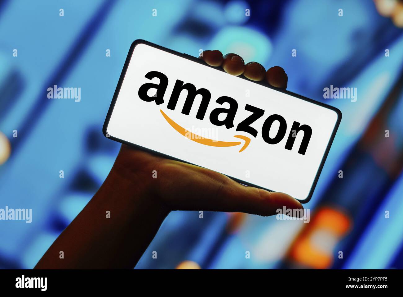 In this photo illustration, the Amazon logo is displayed on a ...