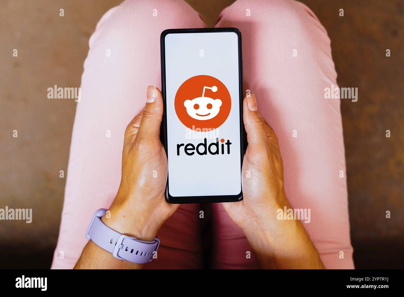 In this photo illustration, the Reddit logo is displayed on a ...