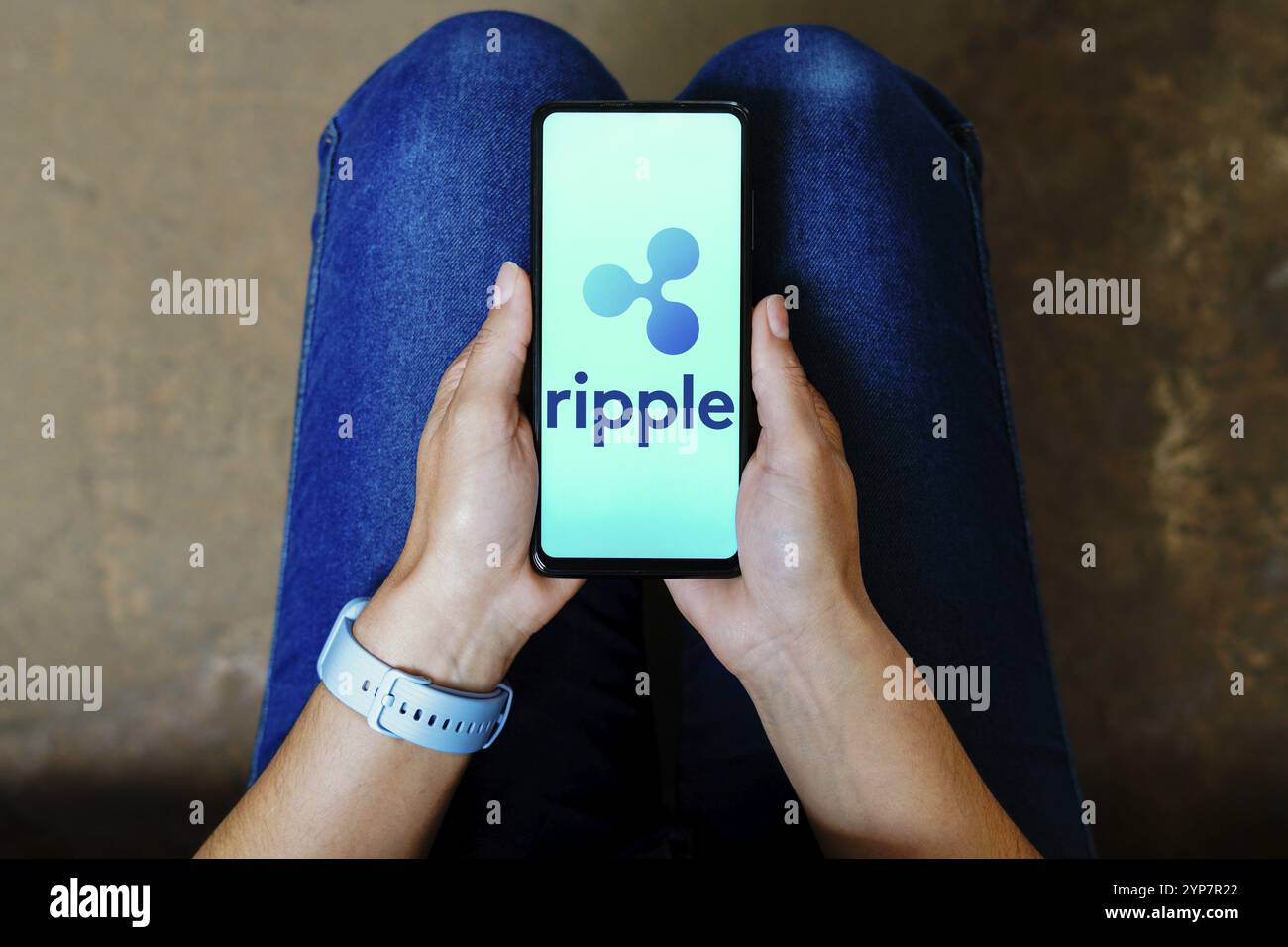 In this photo illustration, the Ripple logo is displayed on a ...