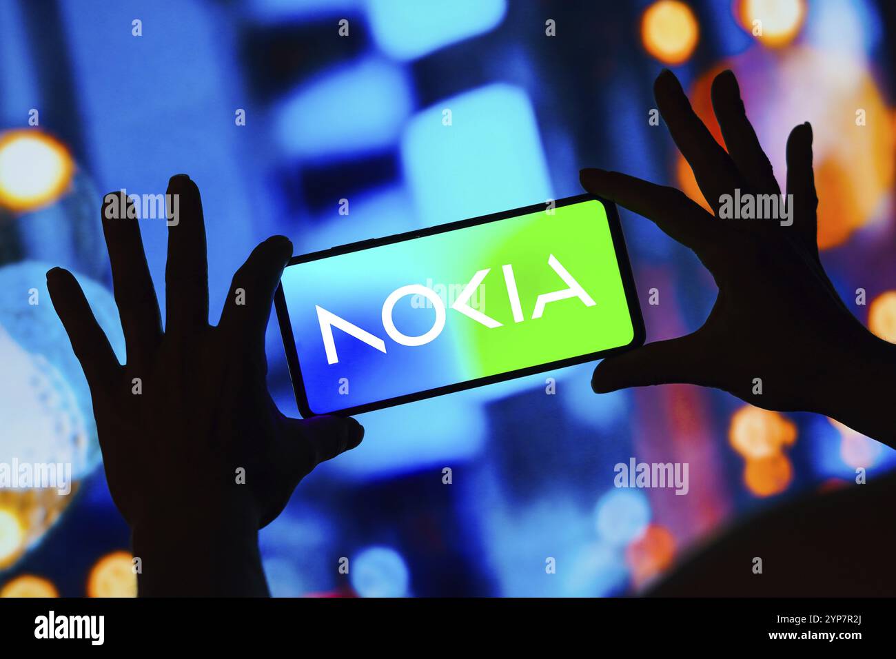 In this photo illustration, the Nokia Corporation logo seen displayed ...