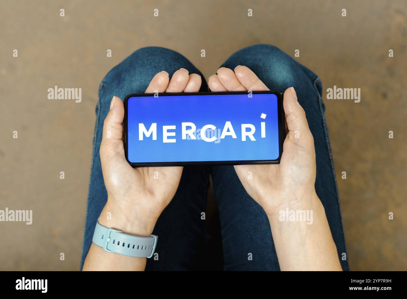 In this photo illustration, the Mercari logo is displayed on a ...