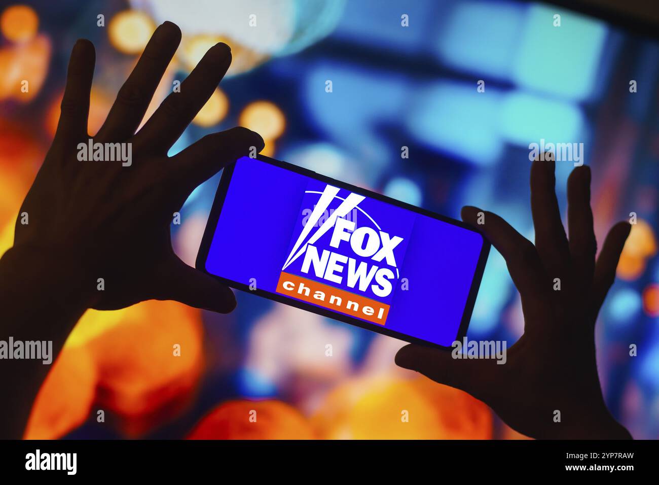 In this photo illustration, the Fox News Channel logo is displayed on a smartphone screen Stock ...