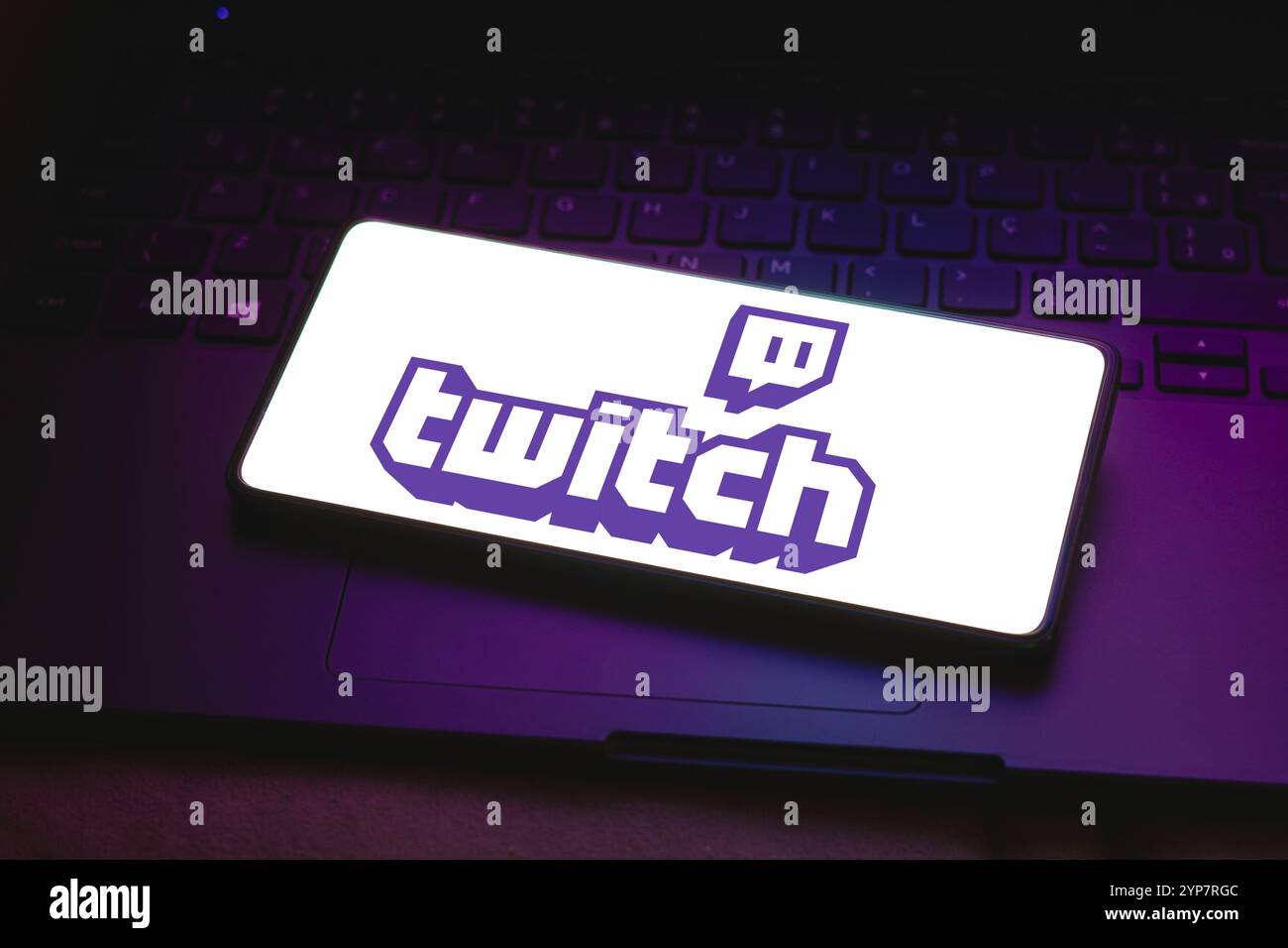 In this photo illustration, the Twitch logo is displayed on a ...