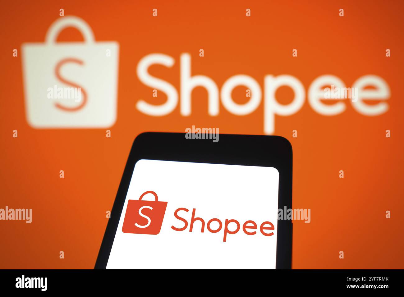 In this photo illustration, the Shopee logo is displayed on a ...