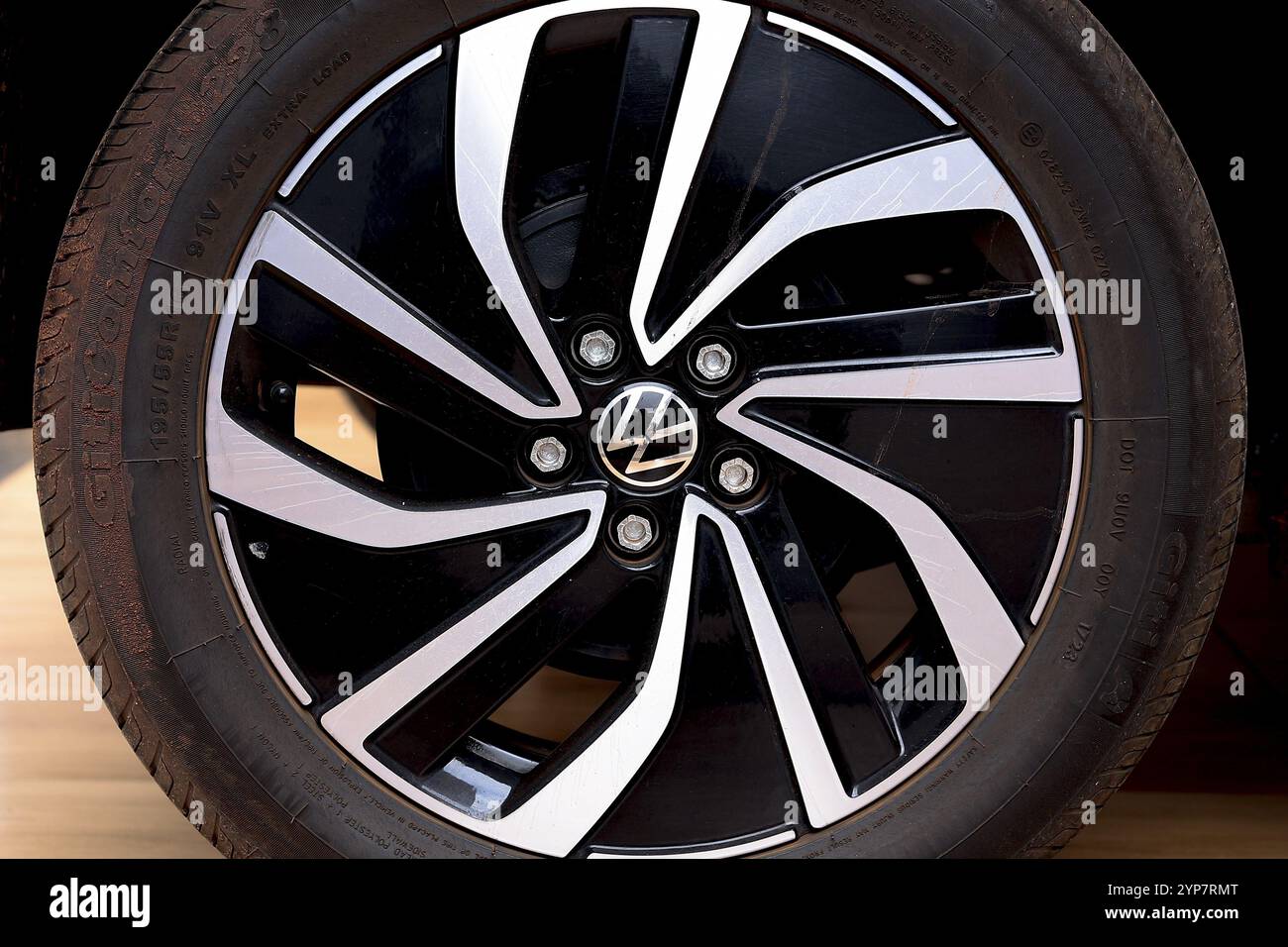 In this photo illustration, the Volkswagen logo is seen on the wheel of ...