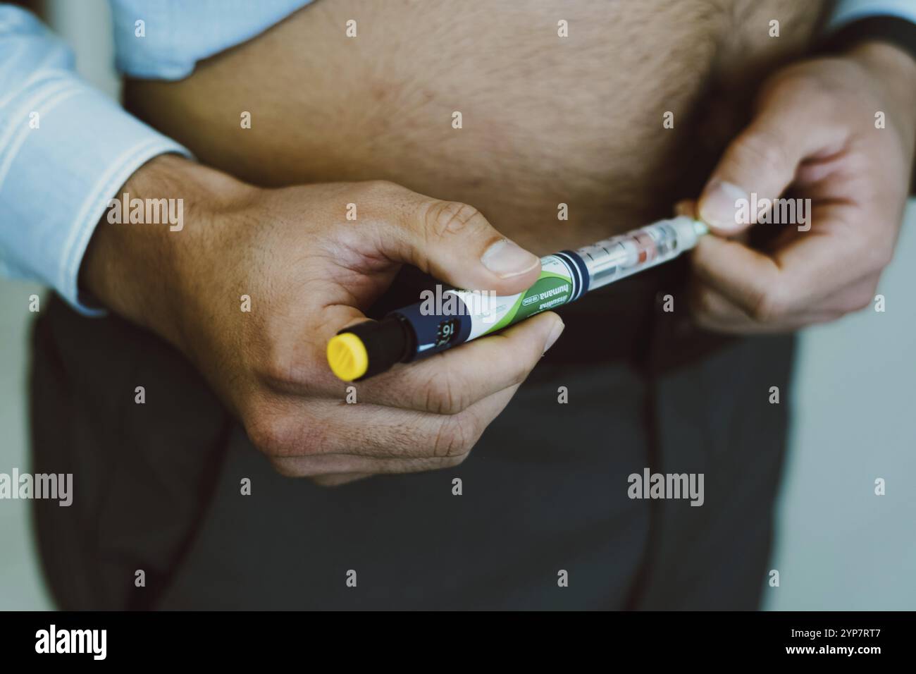 In this photo, a man injects human insulin into the body for blood ...