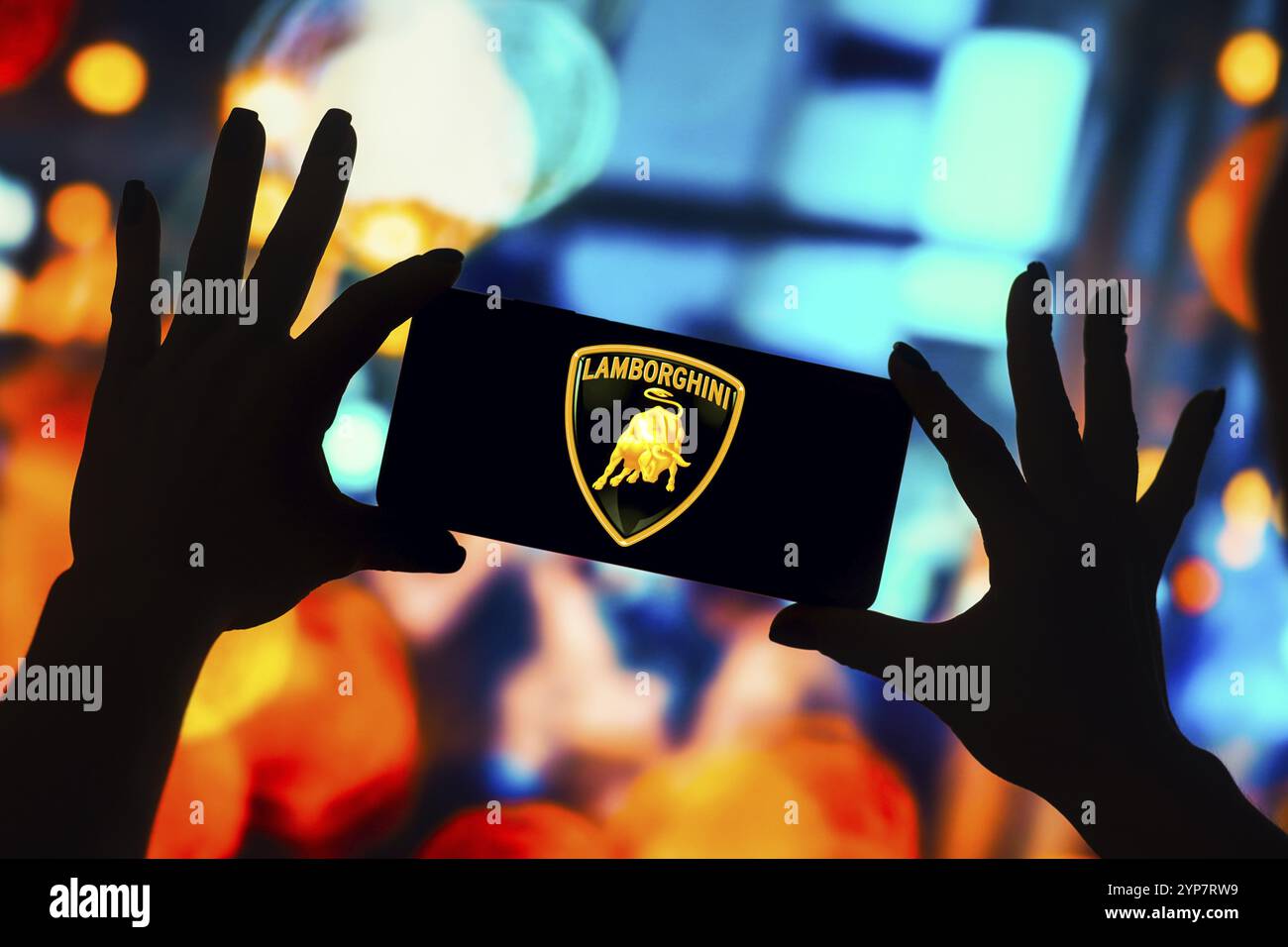 In this photo illustration, the Lamborghini logo is displayed on a ...