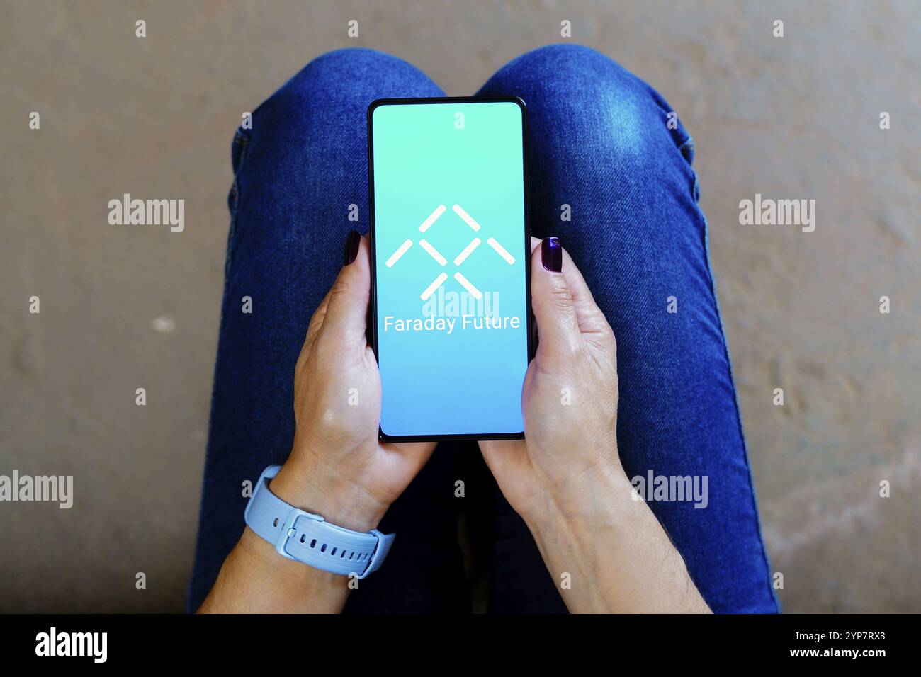 In this photo illustration, the Faraday Future logo is displayed on a ...