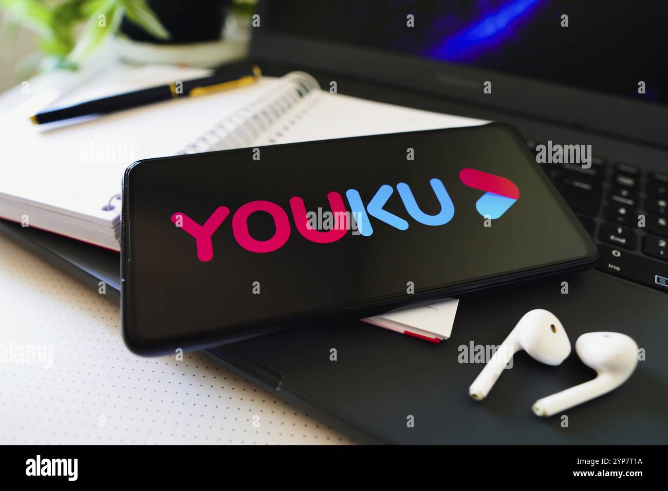 In this photo illustration, the Youku logo is displayed on a smartphone ...