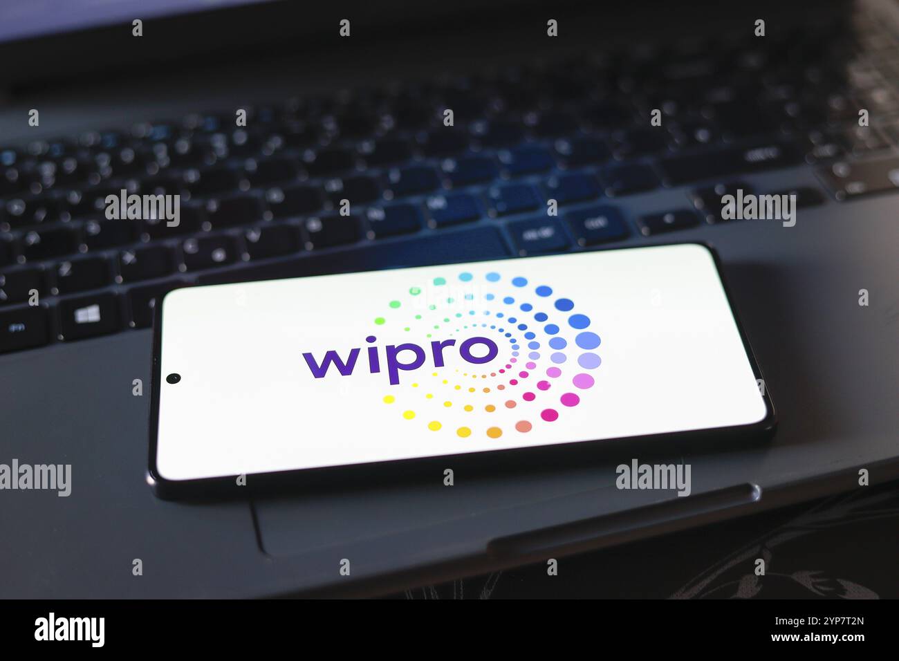 In this photo illustration, the Wipro Technologies logo is displayed on a smartphone screen ...