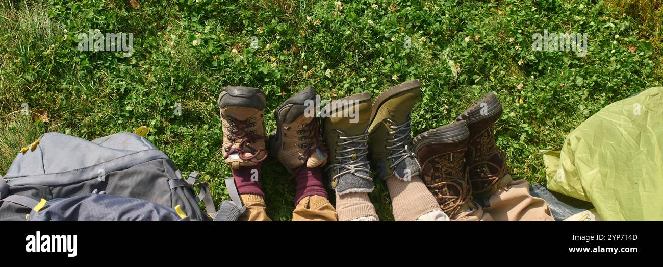 Website banner with high angle shot of unrecognizable camper legs ...