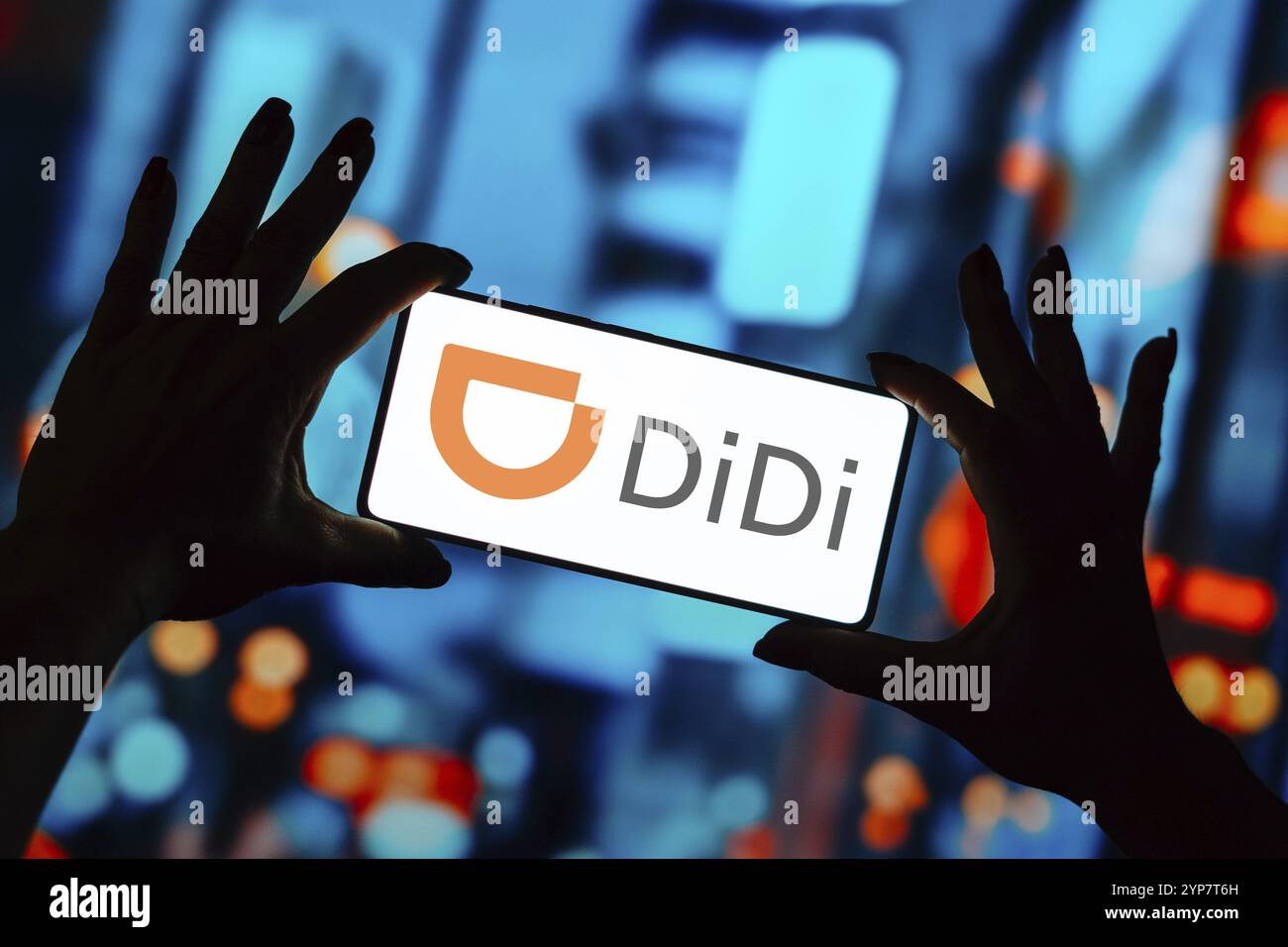 In this photo illustration, the Didi Chuxing logo is displayed on a ...