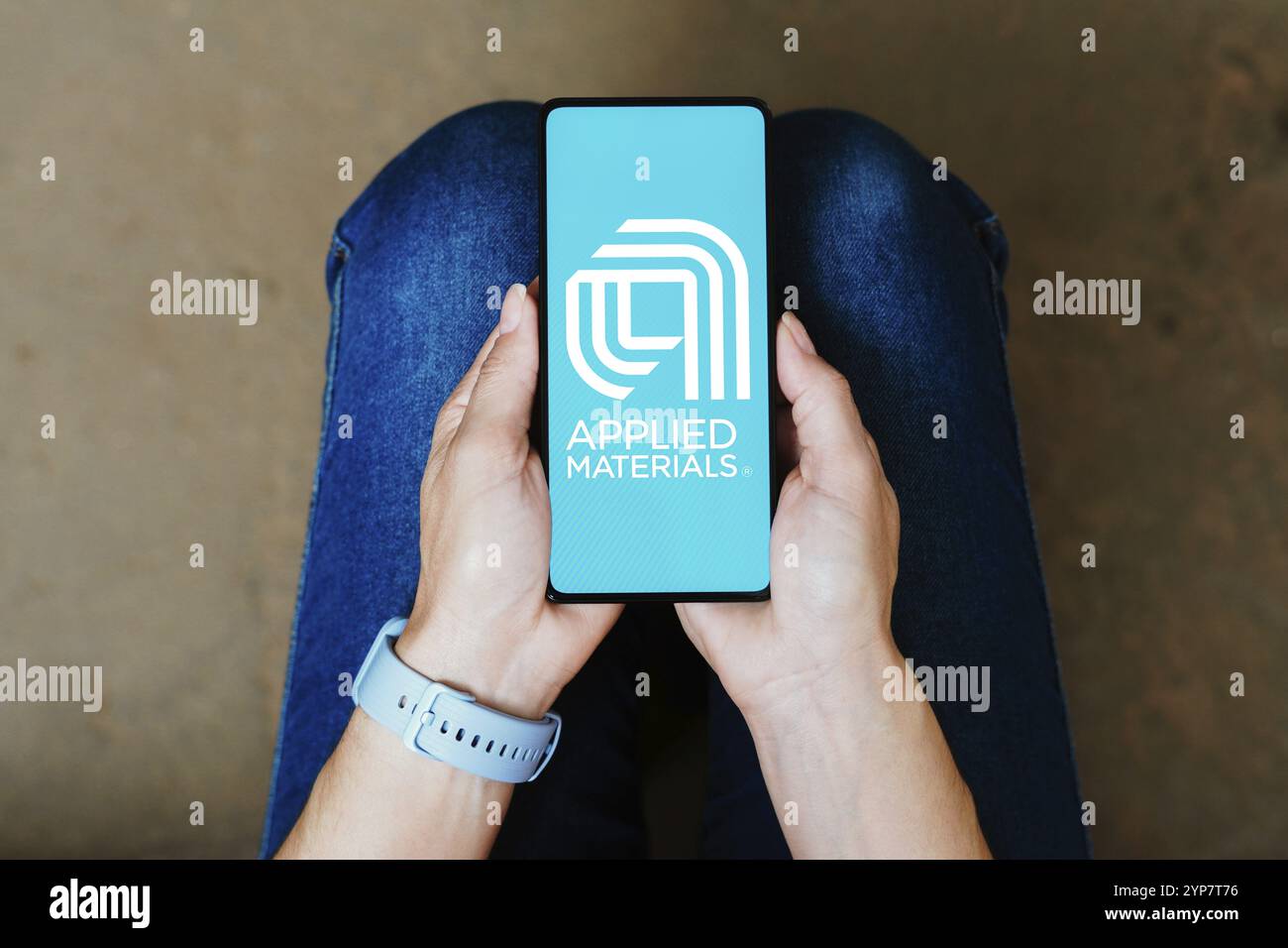 In this photo illustration, the Applied Materials logo is displayed on ...