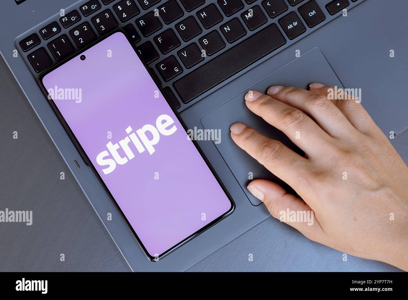 In this photo illustration, the Stripe logo is displayed on a ...