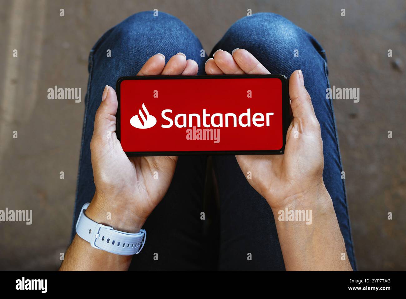In this photo illustration, the Santander logo is displayed on a ...