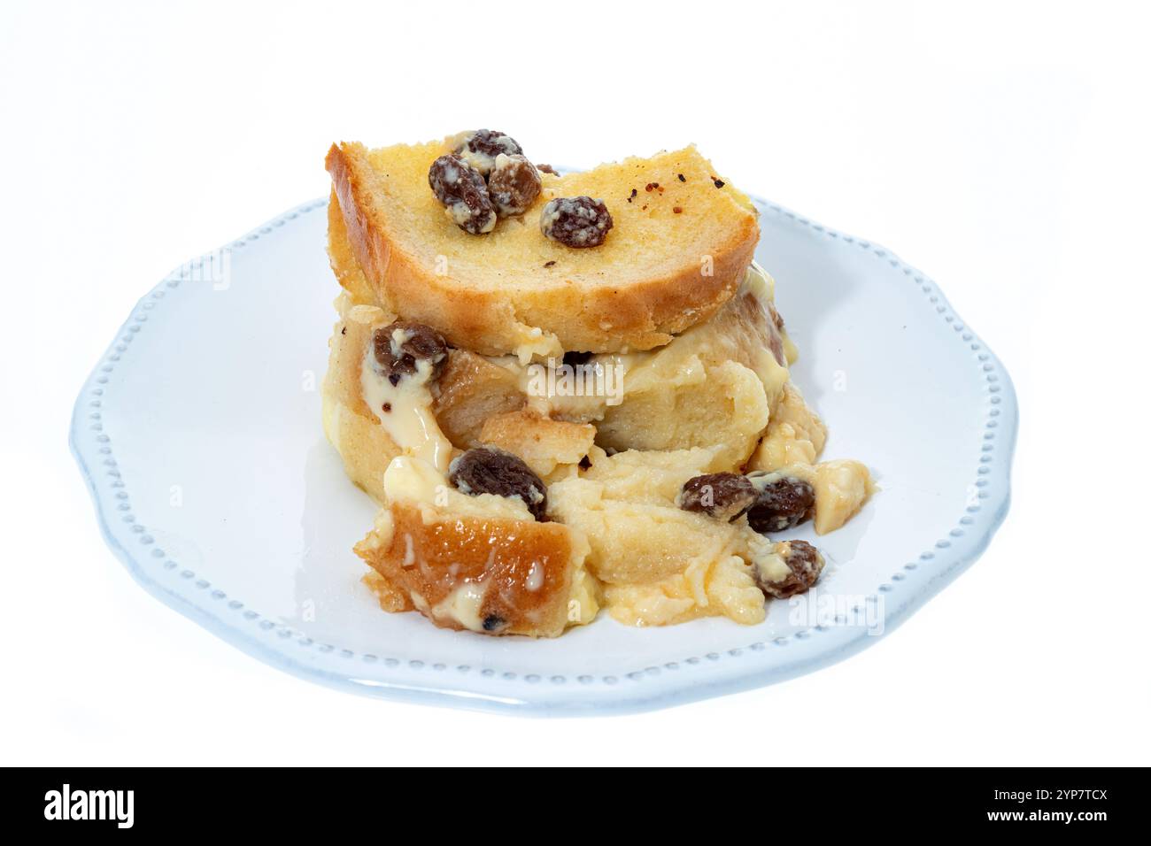 Serving of bread and butter pudding - white background Stock Photo - Alamy