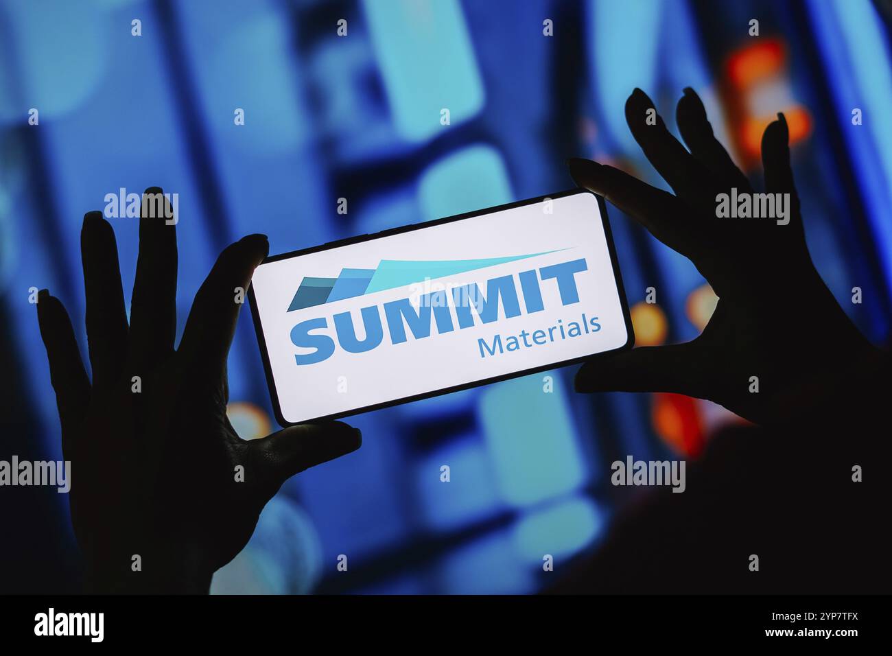 In this photo illustration, the Summit Materials logo is displayed on a ...