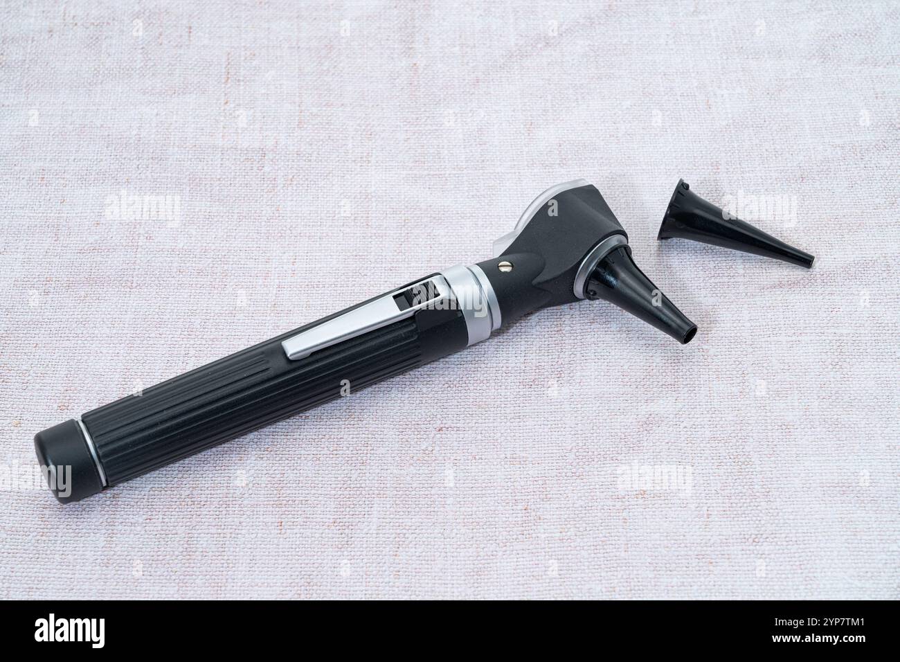 An audiologists otoscope on a plain background Stock Photo - Alamy