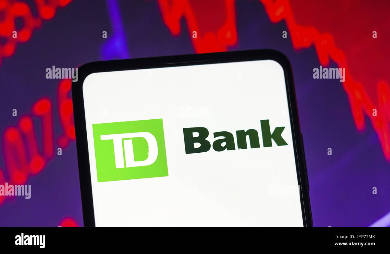 In this photo illustration the TD Bank logo seen displayed on a ...