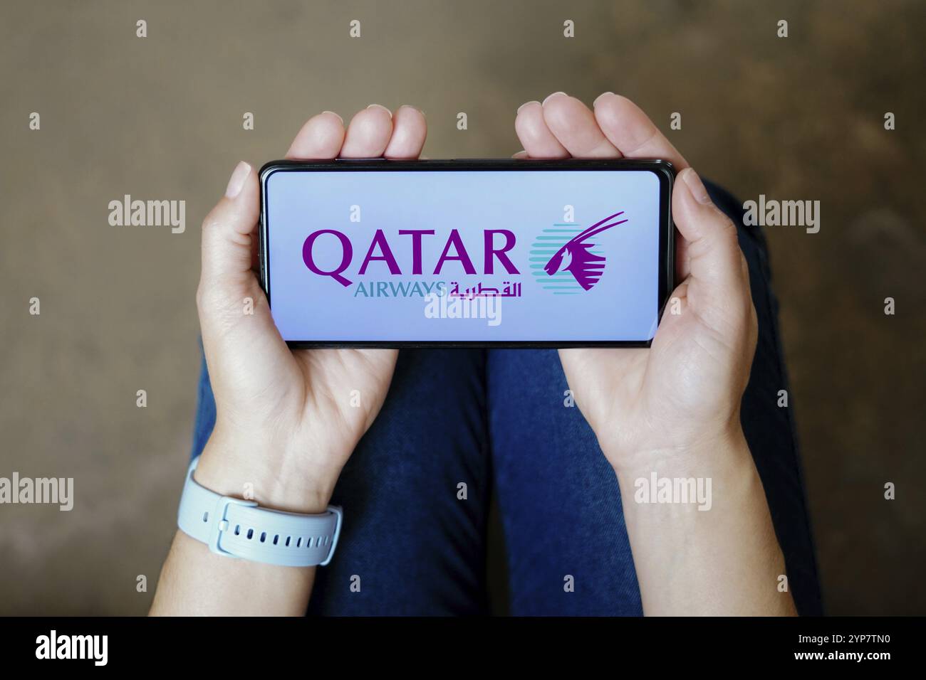 In this photo illustration, the Qatar Airways logo seen displayed on a ...