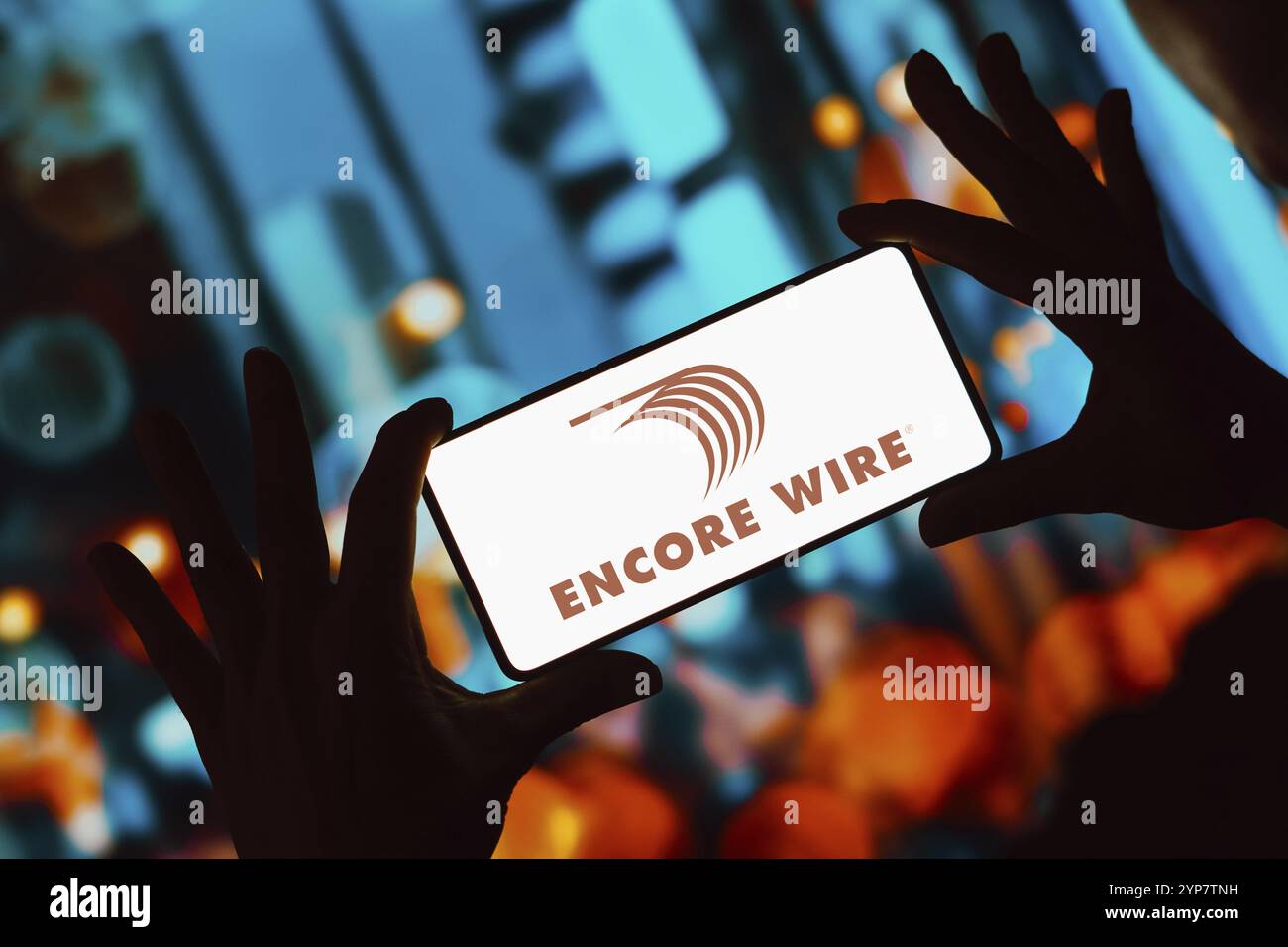 In this photo illustration, the Encore Wire logo is displayed on a ...