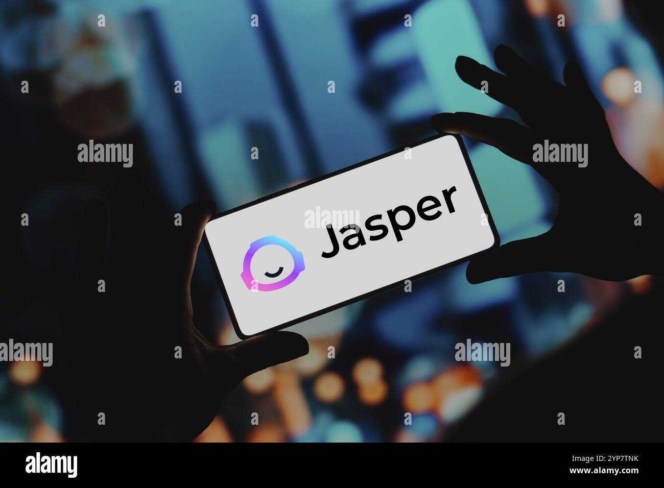 In this photo illustration, the Jasper AI logo is displayed on a ...