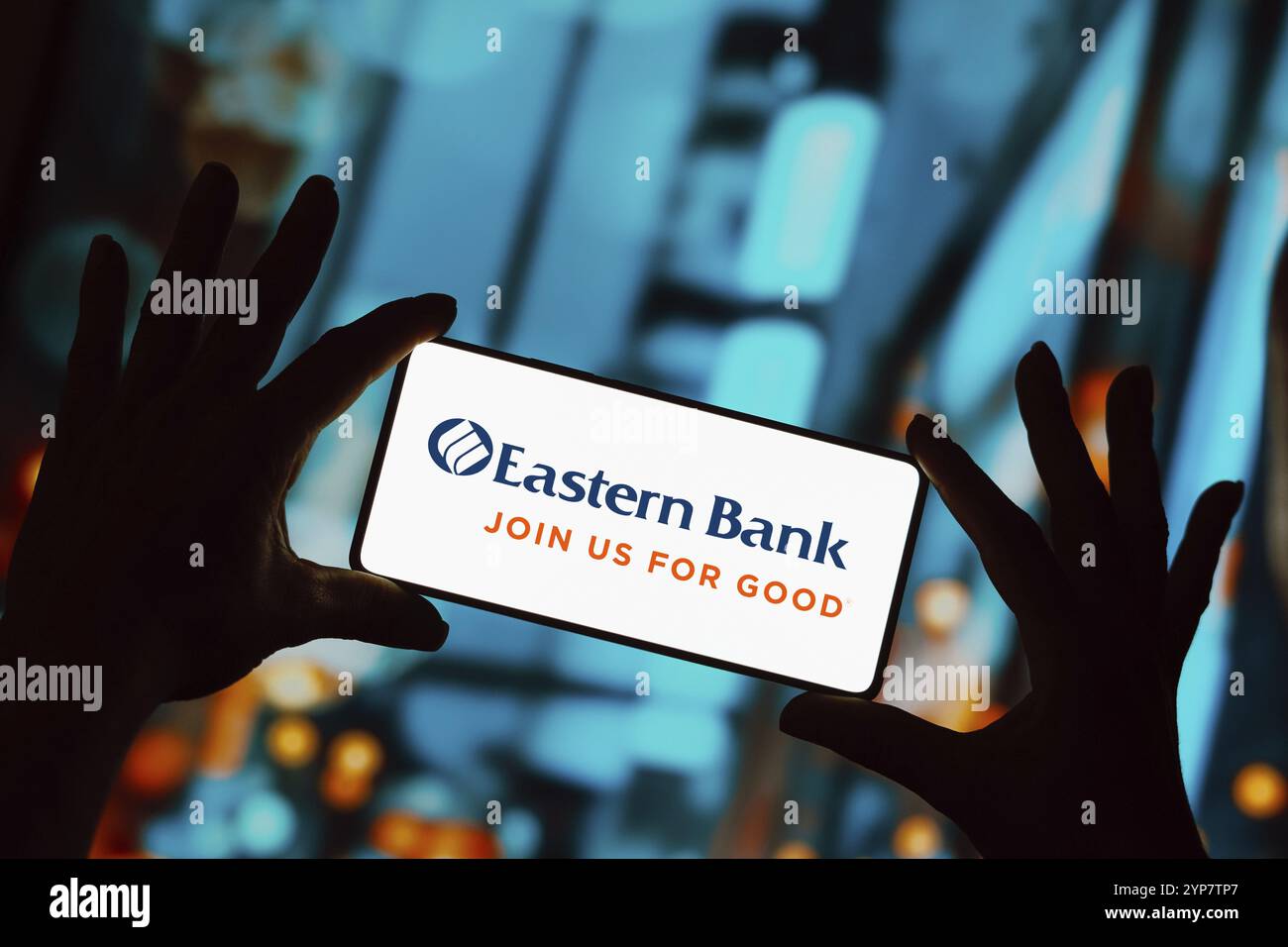 In this photo illustration, the Eastern Bank logo is displayed on a ...