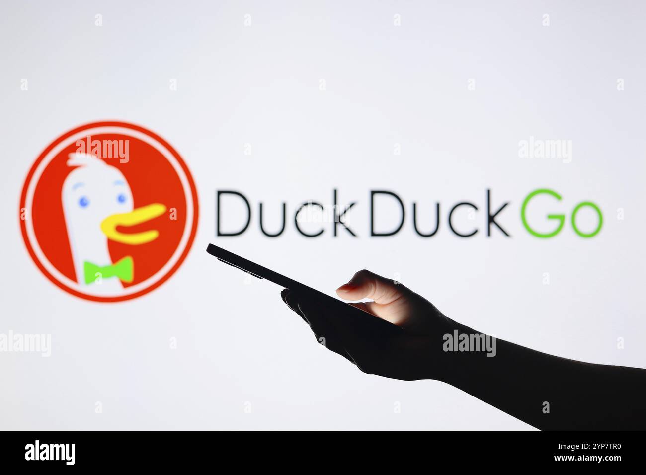 In this photo illustration, the DuckDuckGo logo seen in the background ...