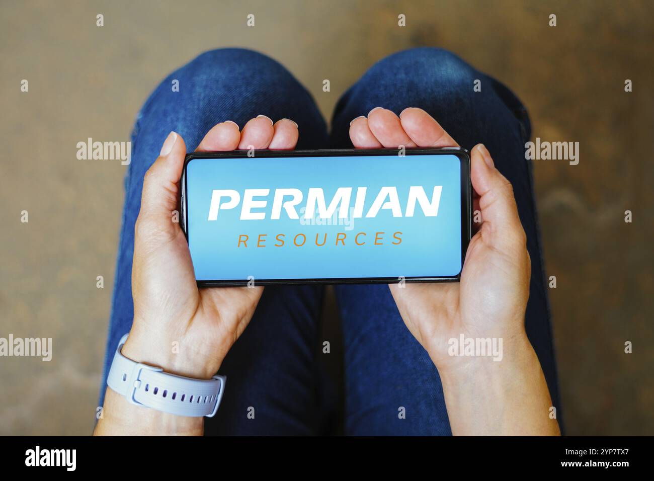 In this photo illustration, the Permian Resources logo is displayed on a smartphone screen Stock ...