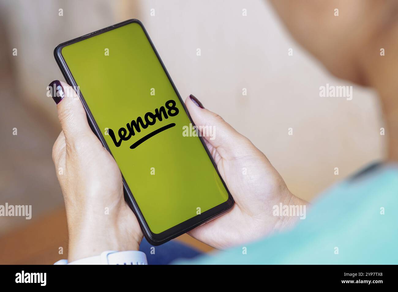 In this photo illustration, the Lemon8 logo is displayed on a smartphone screen Stock Photo - Alamy