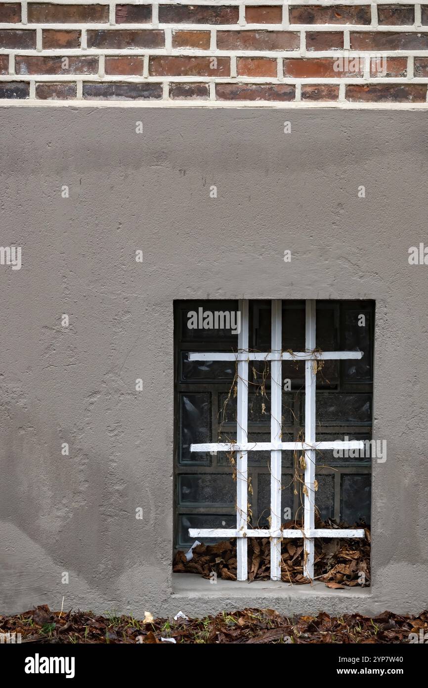 Barred cellar window in an old building Stock Photo - Alamy