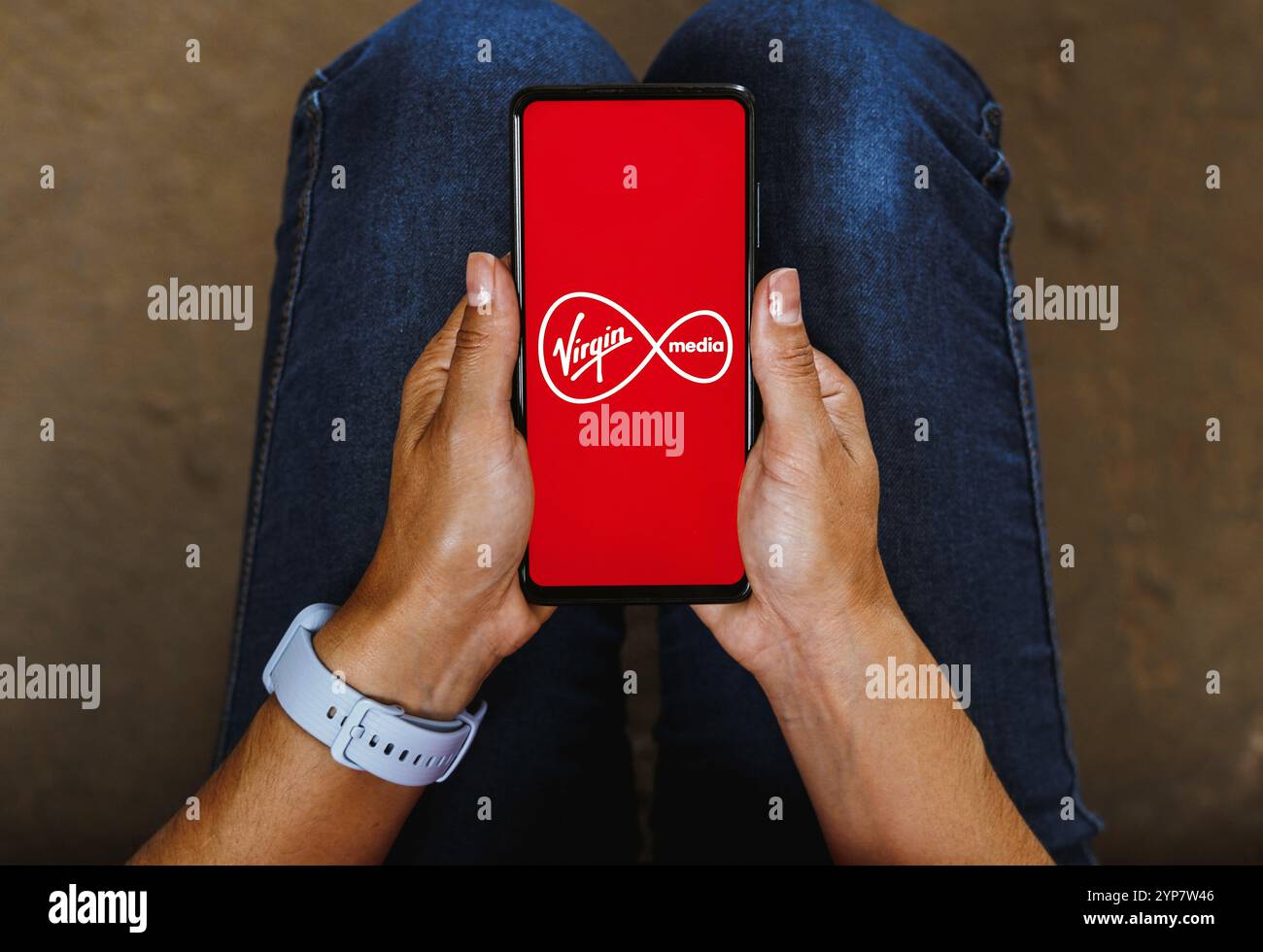 In this photo illustration, the Virgin Media logo is displayed on a ...