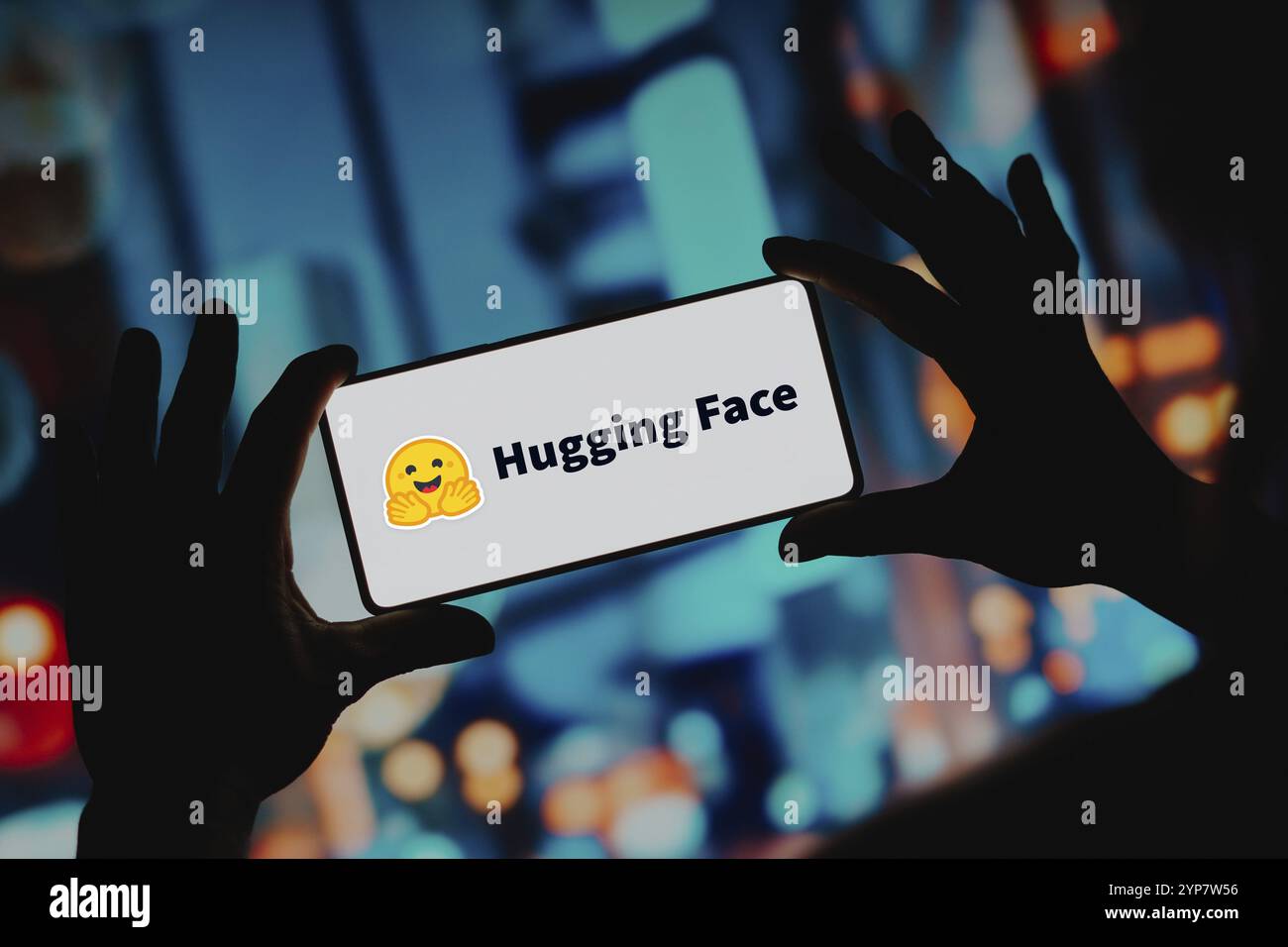 In this photo illustration, the Hugging Face logo is displayed on a ...