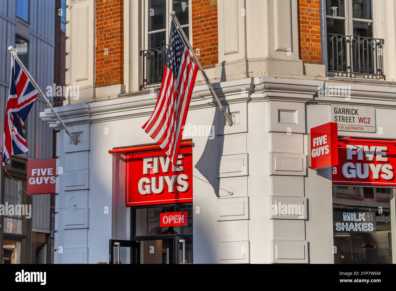 London, UK- September 19, 2024: popular Five Guys restaurant and an ...